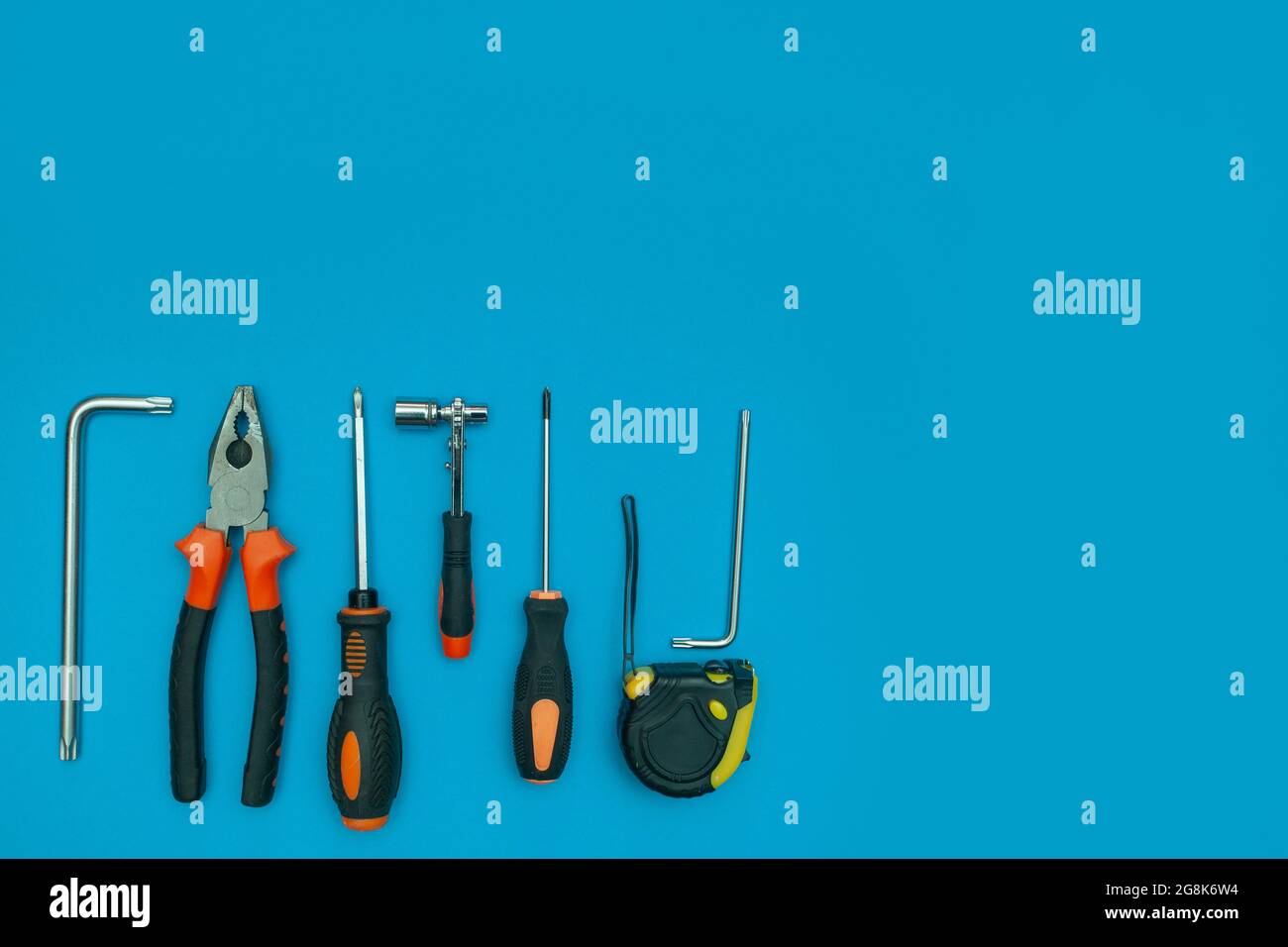 tools on isolated blue background Stock Photo - Alamy