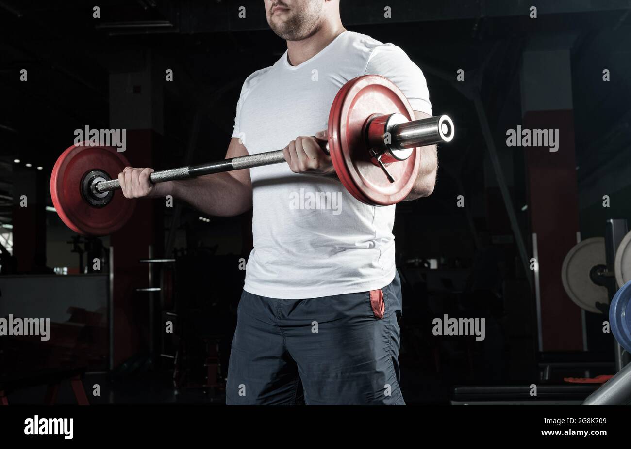 Male athlete lifts the barbell Stock Photo - Alamy