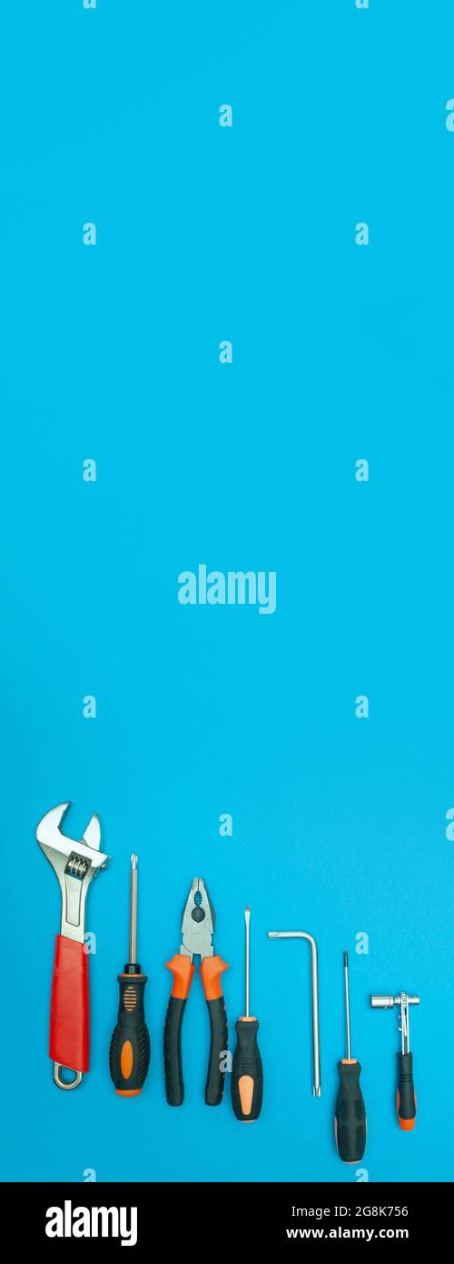 tools on isolated blue background panorama Stock Photo - Alamy