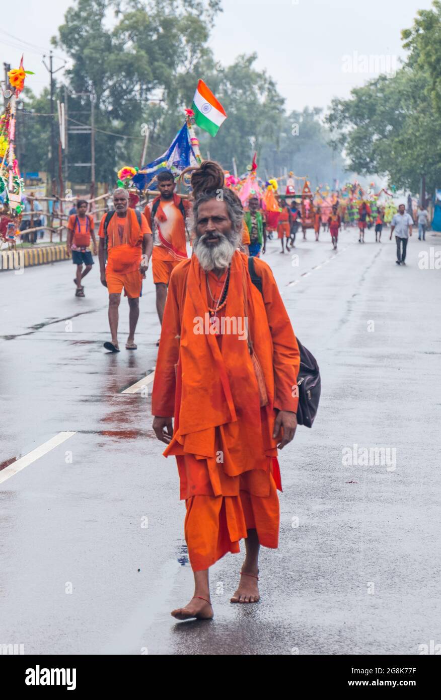 GHAZIABAD, INDIA - JULY 2019: A hindu devotee carrying kanwar on their ...