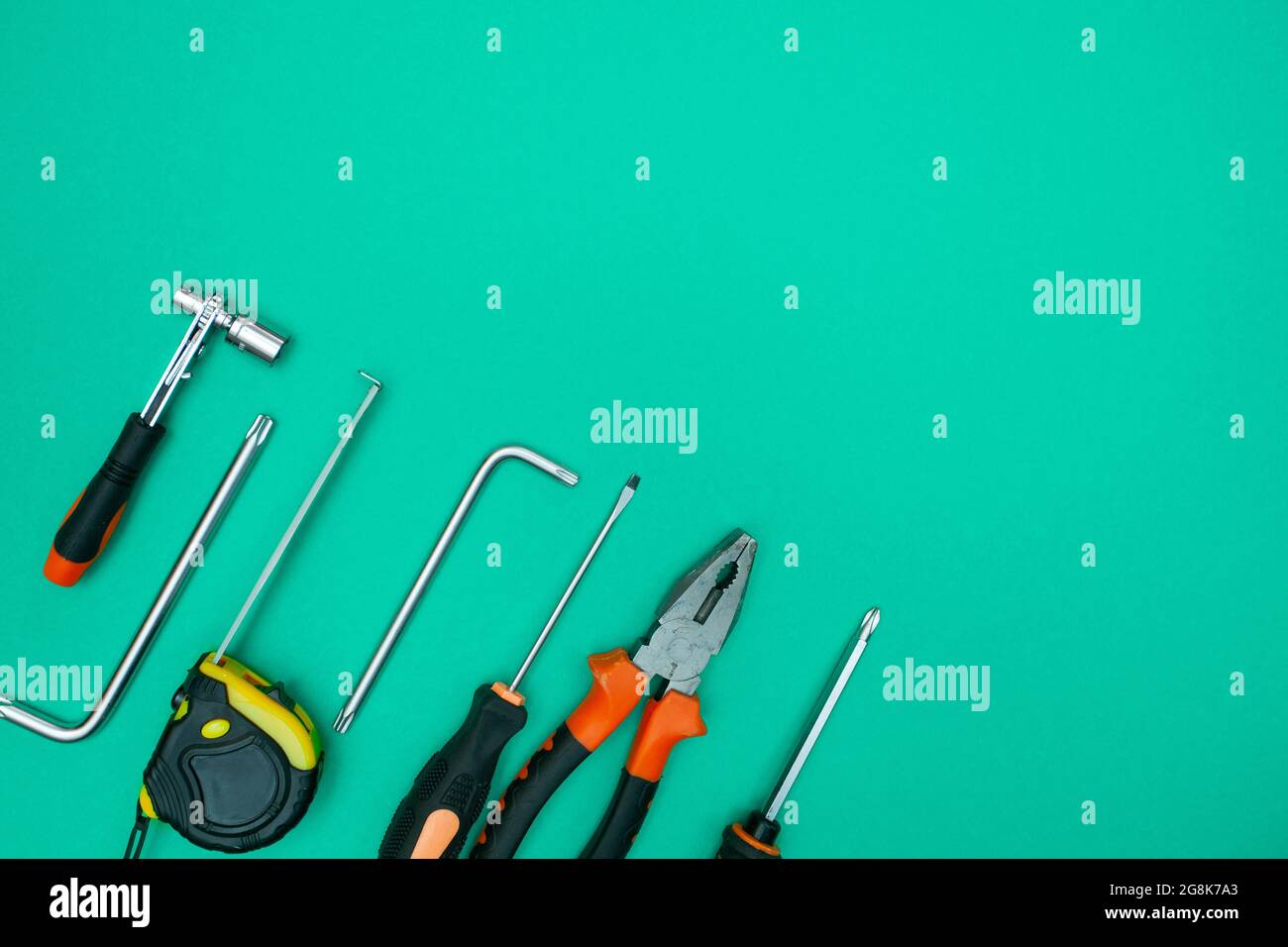 tools on isolated green background Stock Photo - Alamy