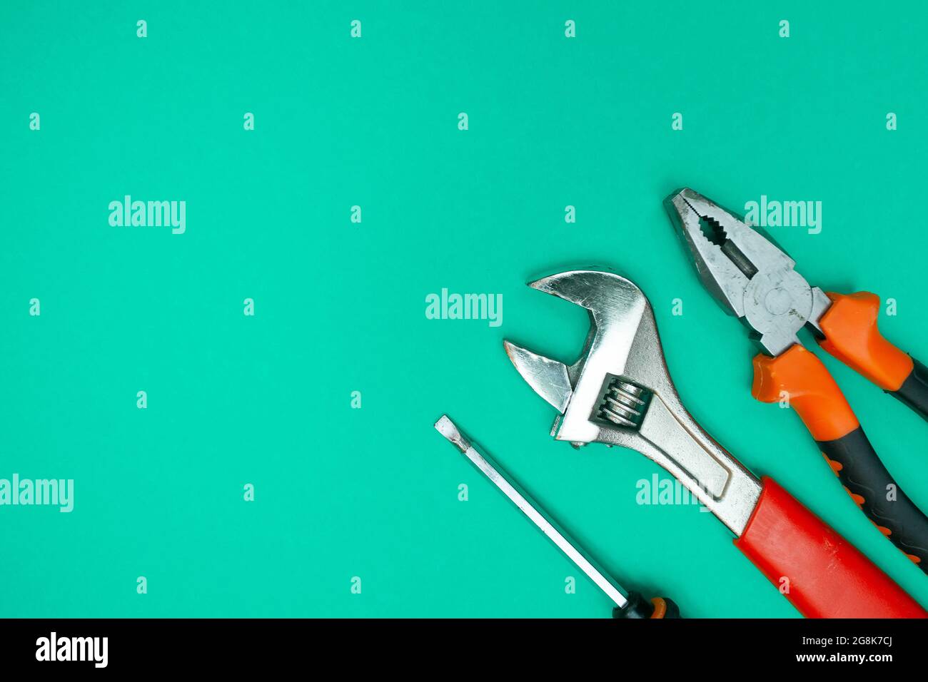 tools on isolated green background Stock Photo - Alamy