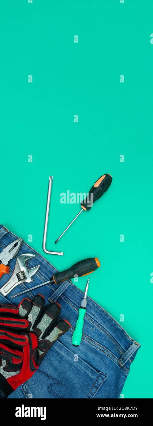 tools on isolated green background panorama Stock Photo - Alamy