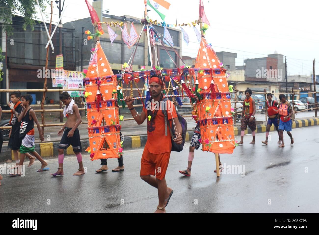 GHAZIABAD, INDIA - JULY 2019: A hindu devotee carrying kanwar on their ...