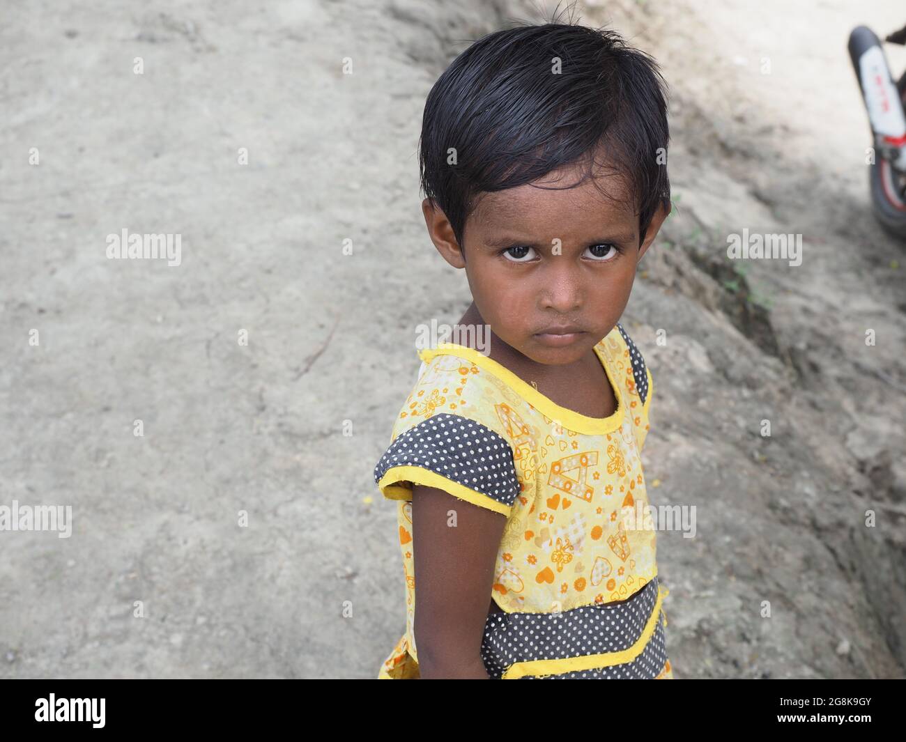 KOLKATA, INDIA - Jun 30, 2021: A girl in the cyclone relief camp set up ...