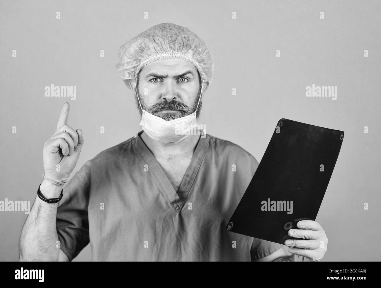 Doctor look at x ray Black and White Stock Photos & Images - Alamy