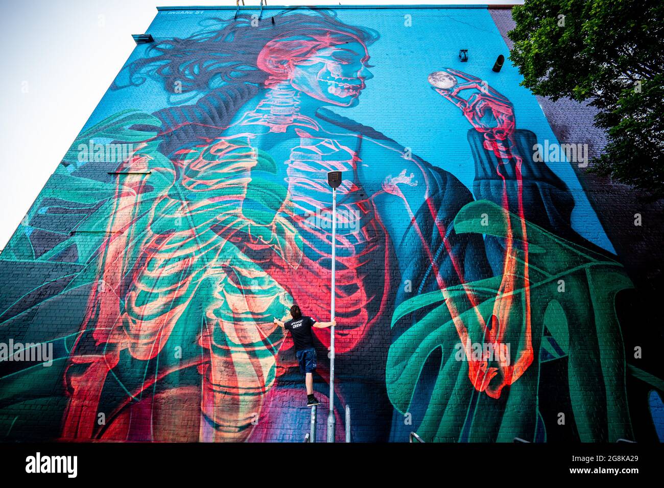Organiser of 'Upfest' Steve Hayles checks a graffiti piece by artist ...