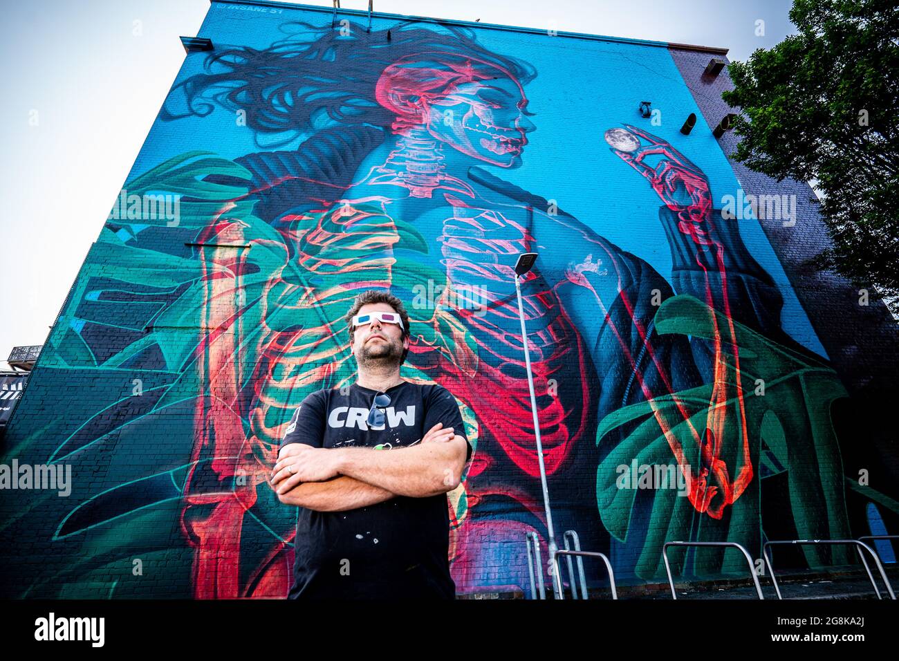 Organiser of 'Upfest' Steve Hayles wears 3D glasses beside a graffiti ...
