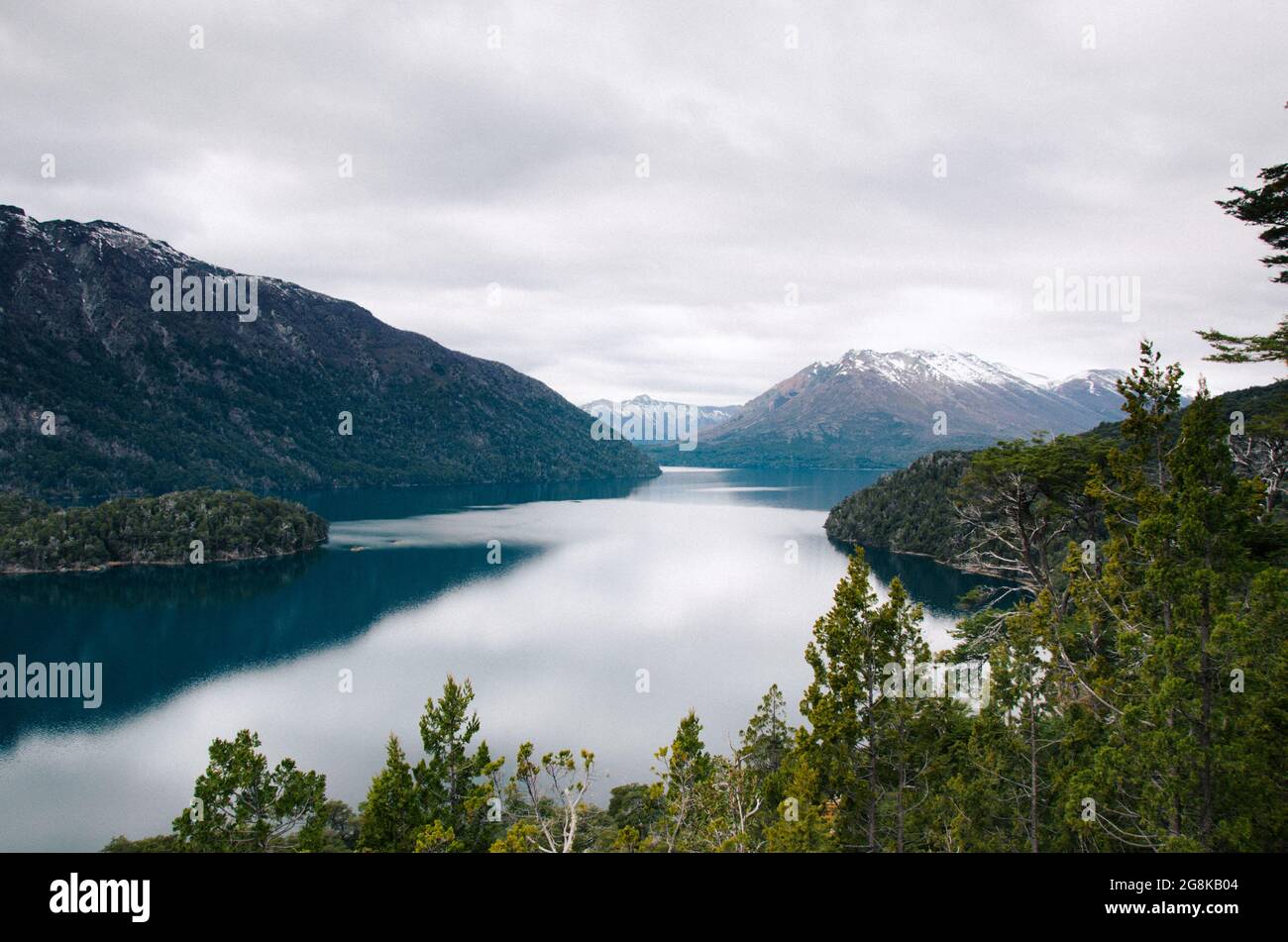 Beautiful view of snowy mountains near water in Rio Negro, Bariloche ...