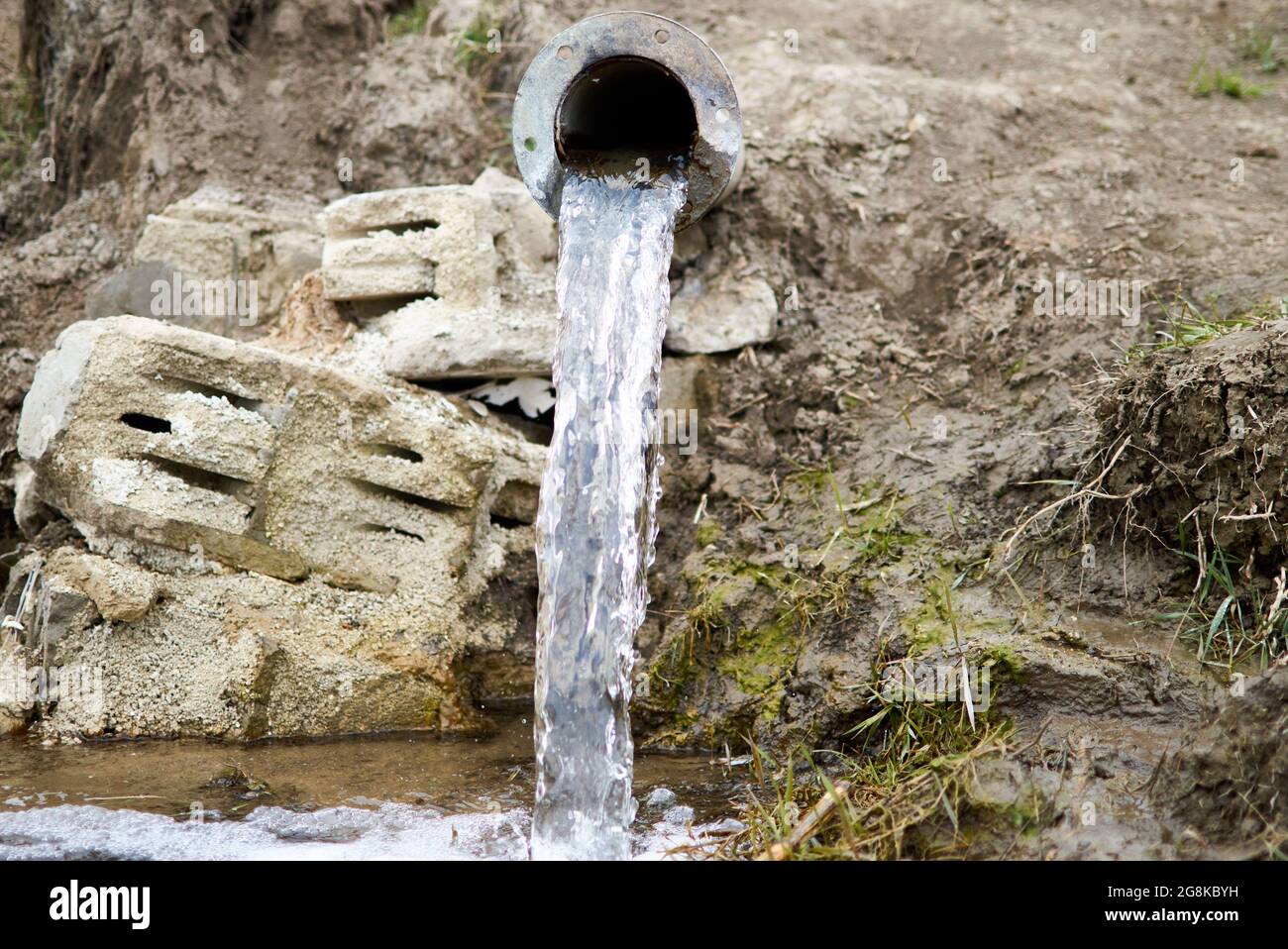 Motion of storm water runoff flowing through drainage culvert under ...