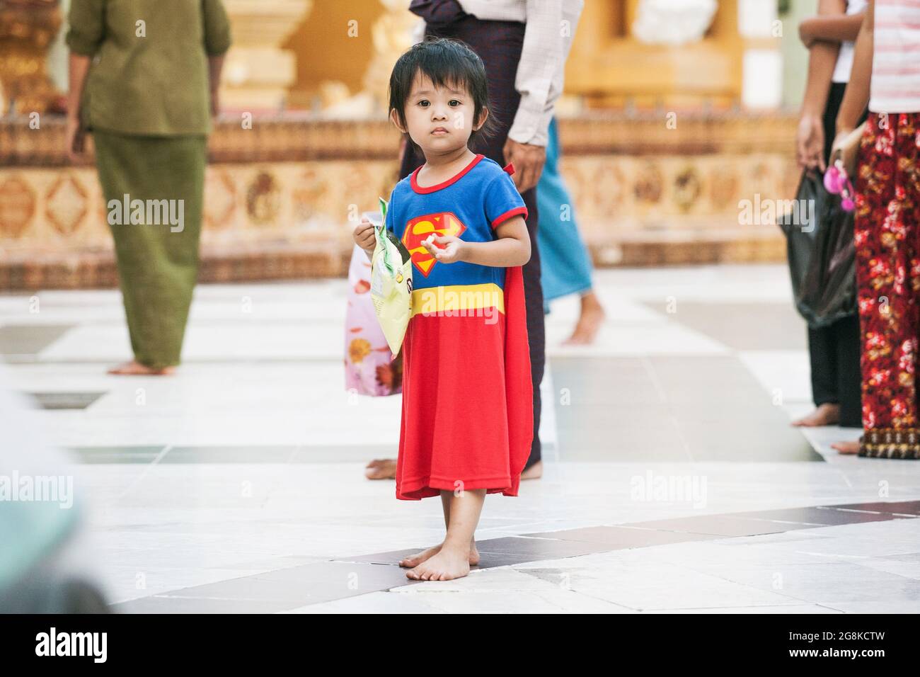 Young Burmese boy dressed as Superhero Superman wearing costume and ...