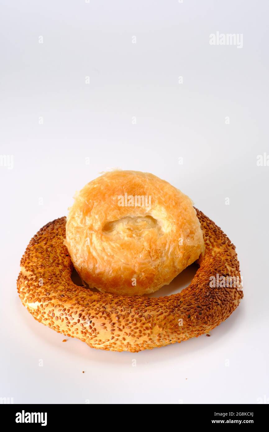 Turkish pastry boyoz and Turkish bagel together on a white background ...
