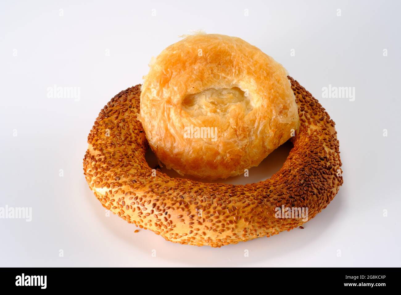 Turkish pastry boyoz and Turkish bagel together on a white background ...