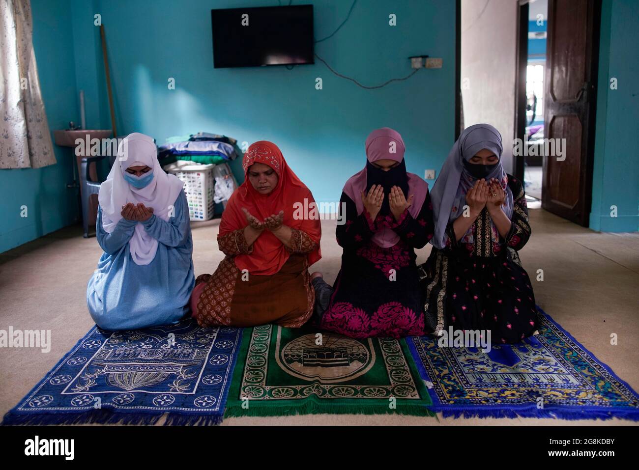 Kathmandu, Nepal. 21st July, 2021. Muslim devotees pray at their home ...