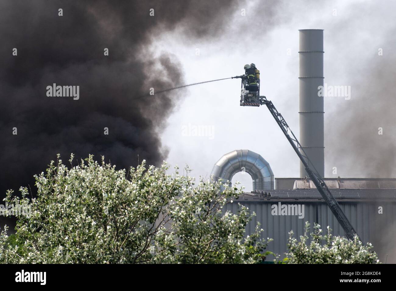Erftstadt, Germany. 21st July, 2021. Firefighters fight a fire in a ...