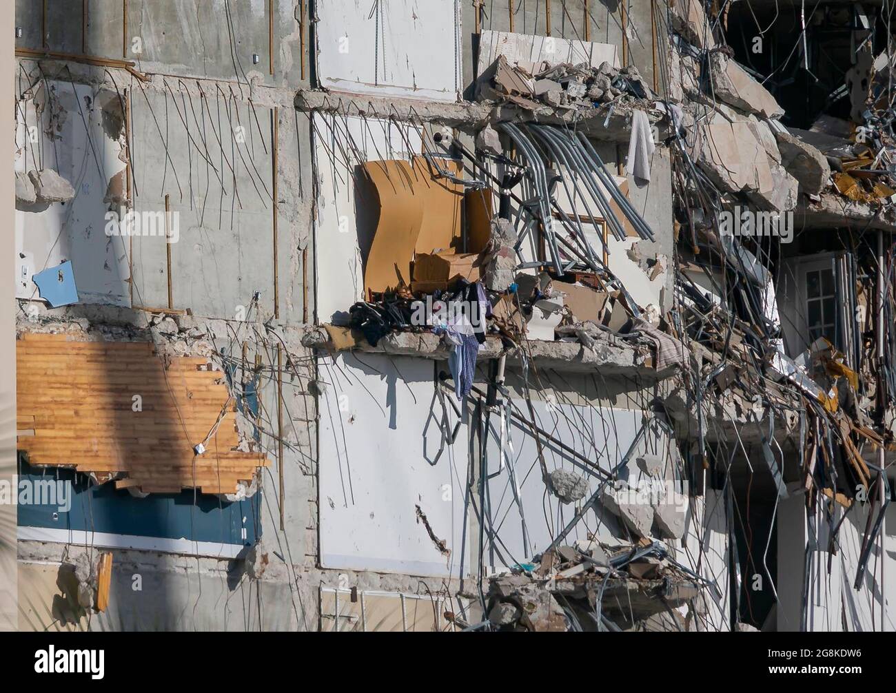 Personal belongings can be seen inside the partially collapsed ...