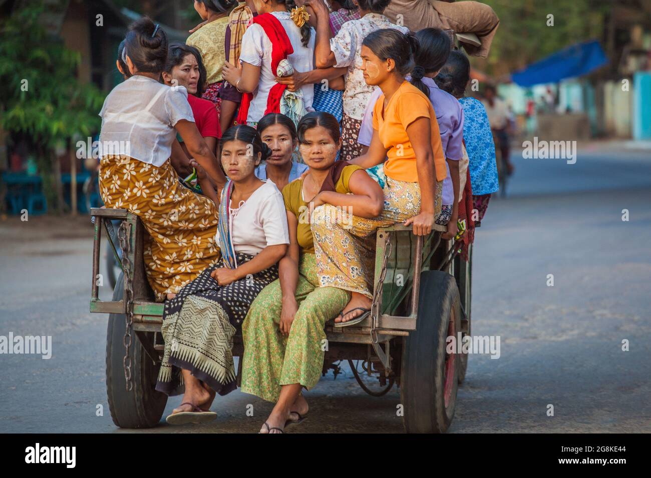 Group of Burmese female passengers with thanaka face powder crammed on ...