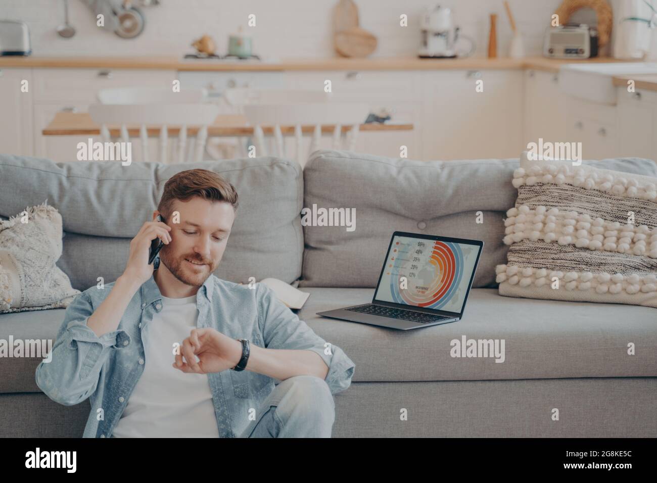 Young company male worker calling his supervisor while sending ...