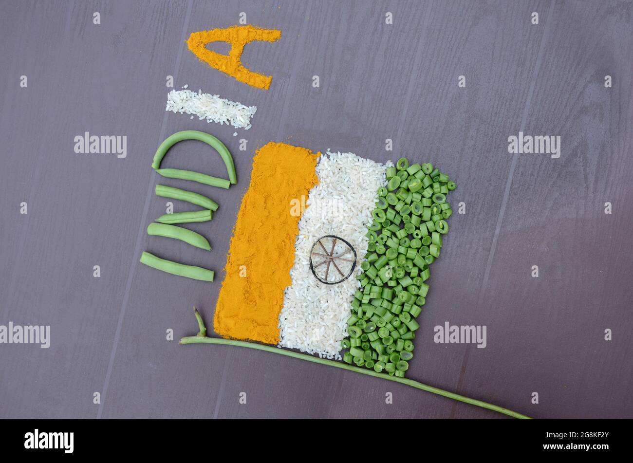 Overhead shot of the Indian flag and word India made of orange turmeric ...