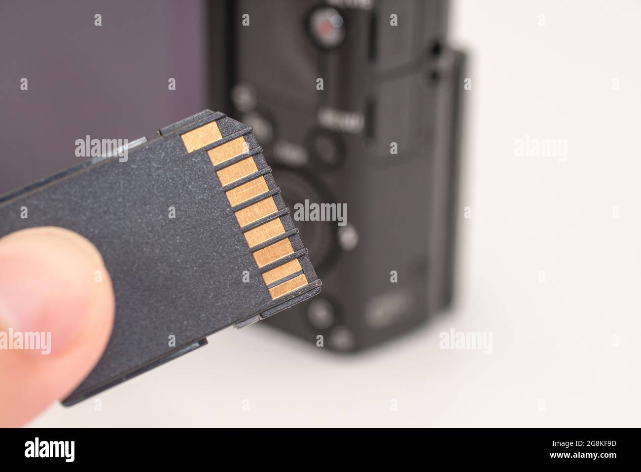 male hand holding sd memory card. Isolated on white background Stock ...