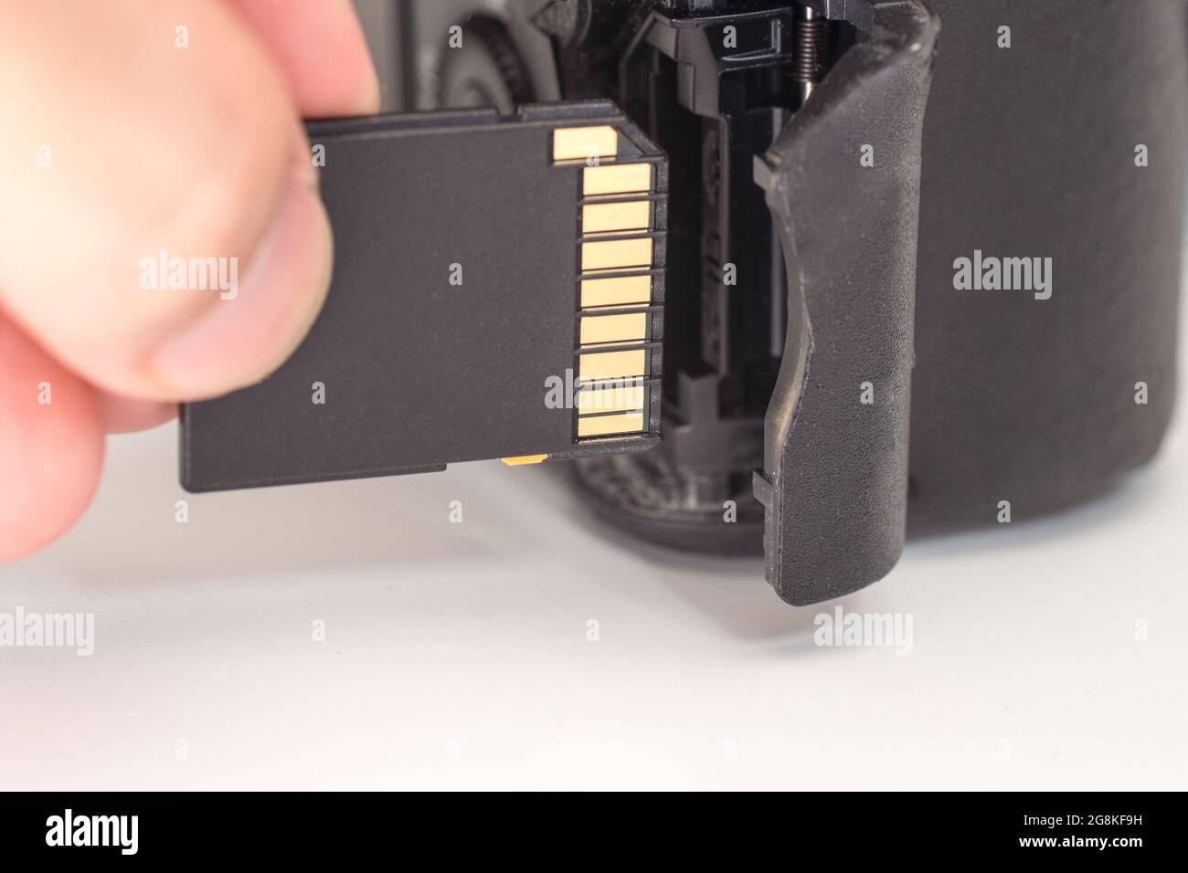 male hand holding sd memory card. Isolated on white background Stock ...