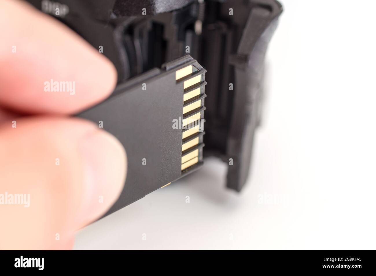 male hand holding sd memory card. Isolated on white background Stock ...