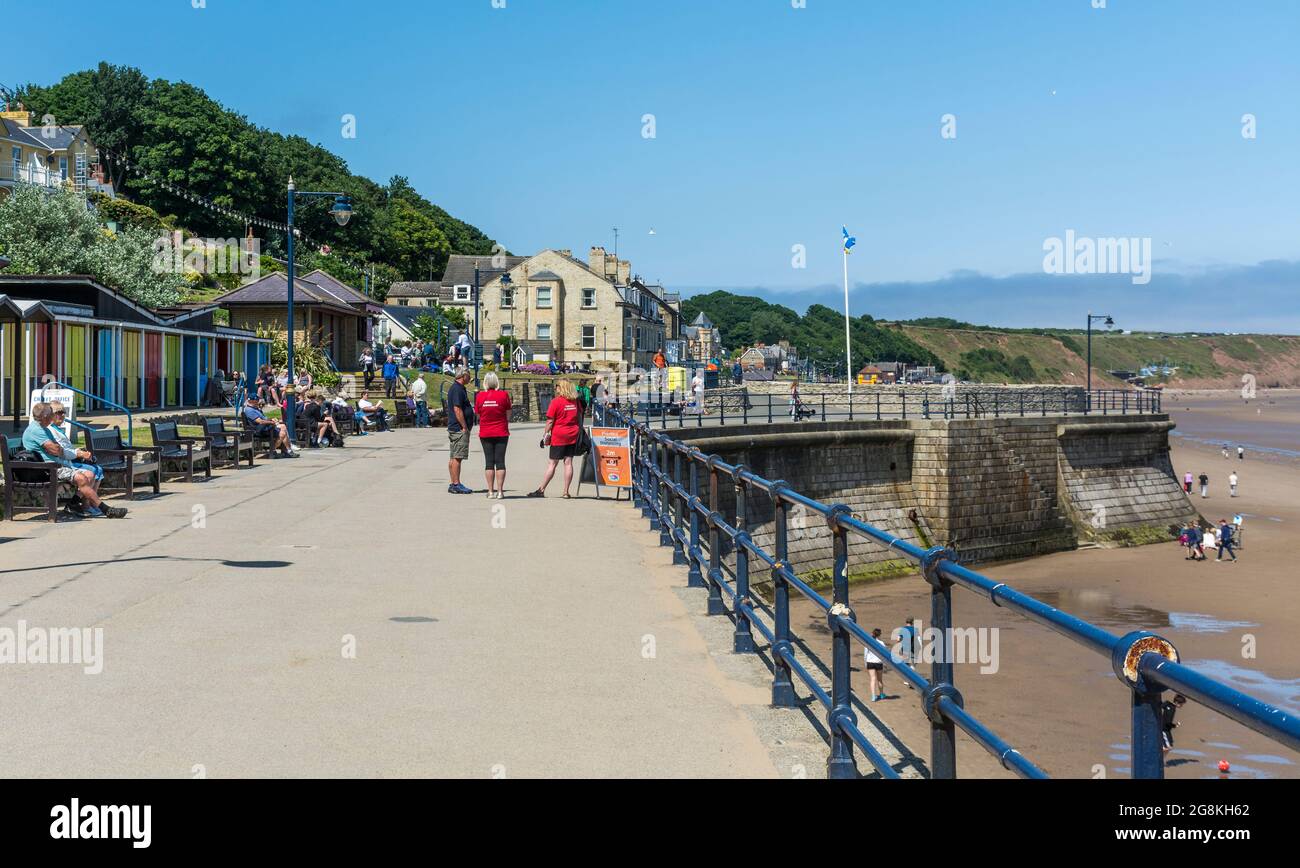 A summers day on the promenade at Filey on the North Yorkshire coast ...