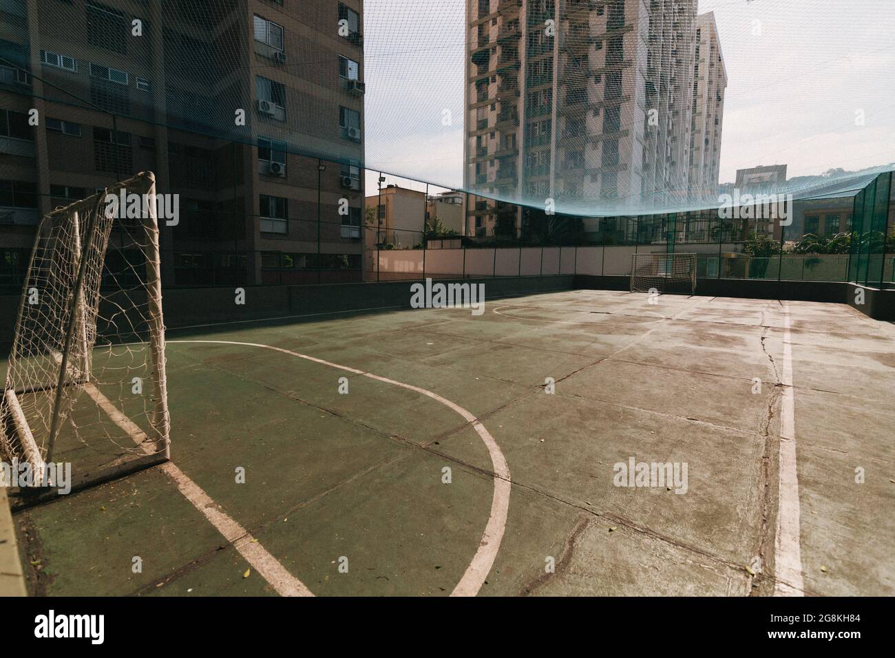 High angle shot of an outdoors football field in an urban landscape ...