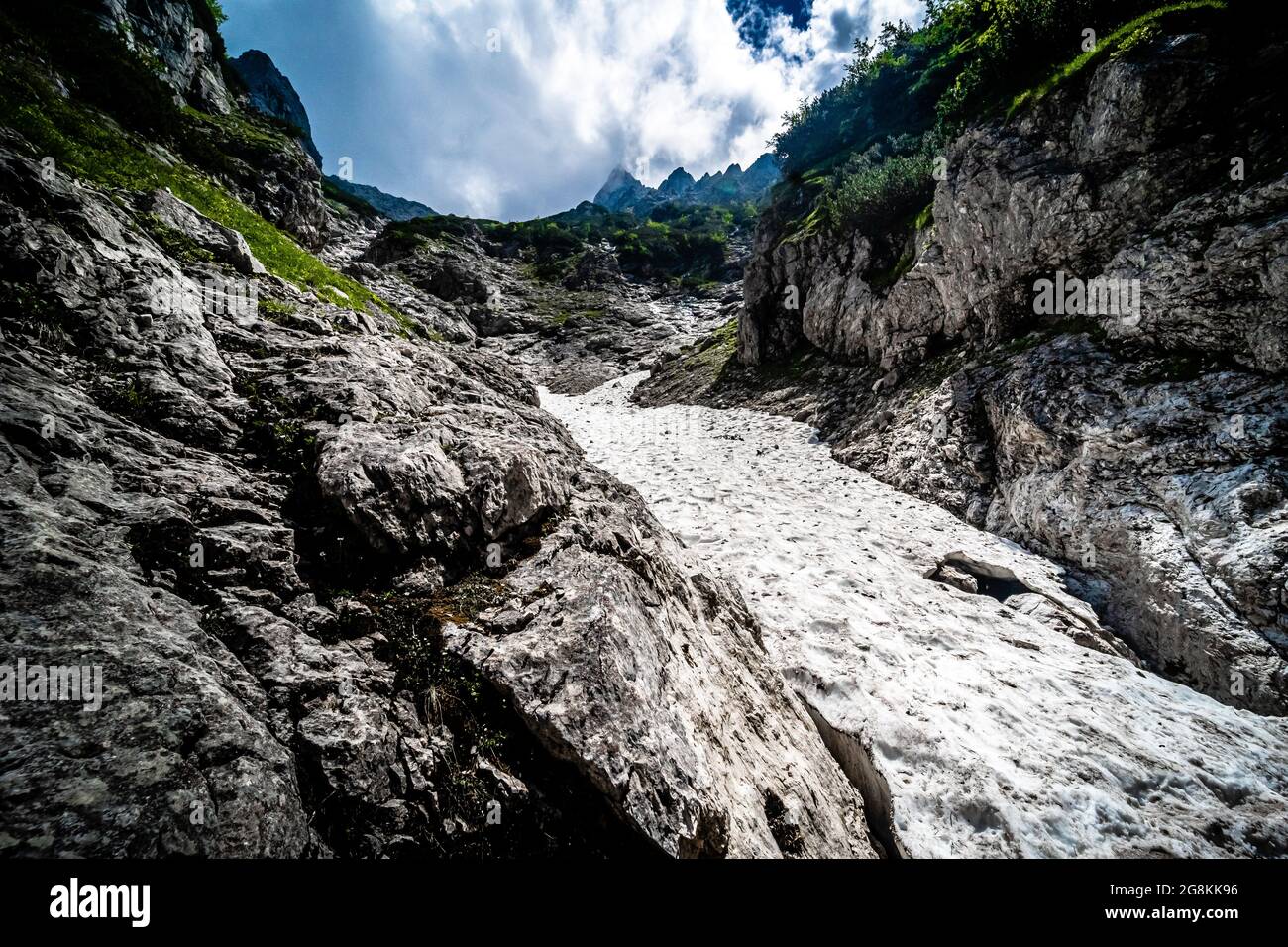 Scenic view of a river flowing among boulders and between rock cliffs ...