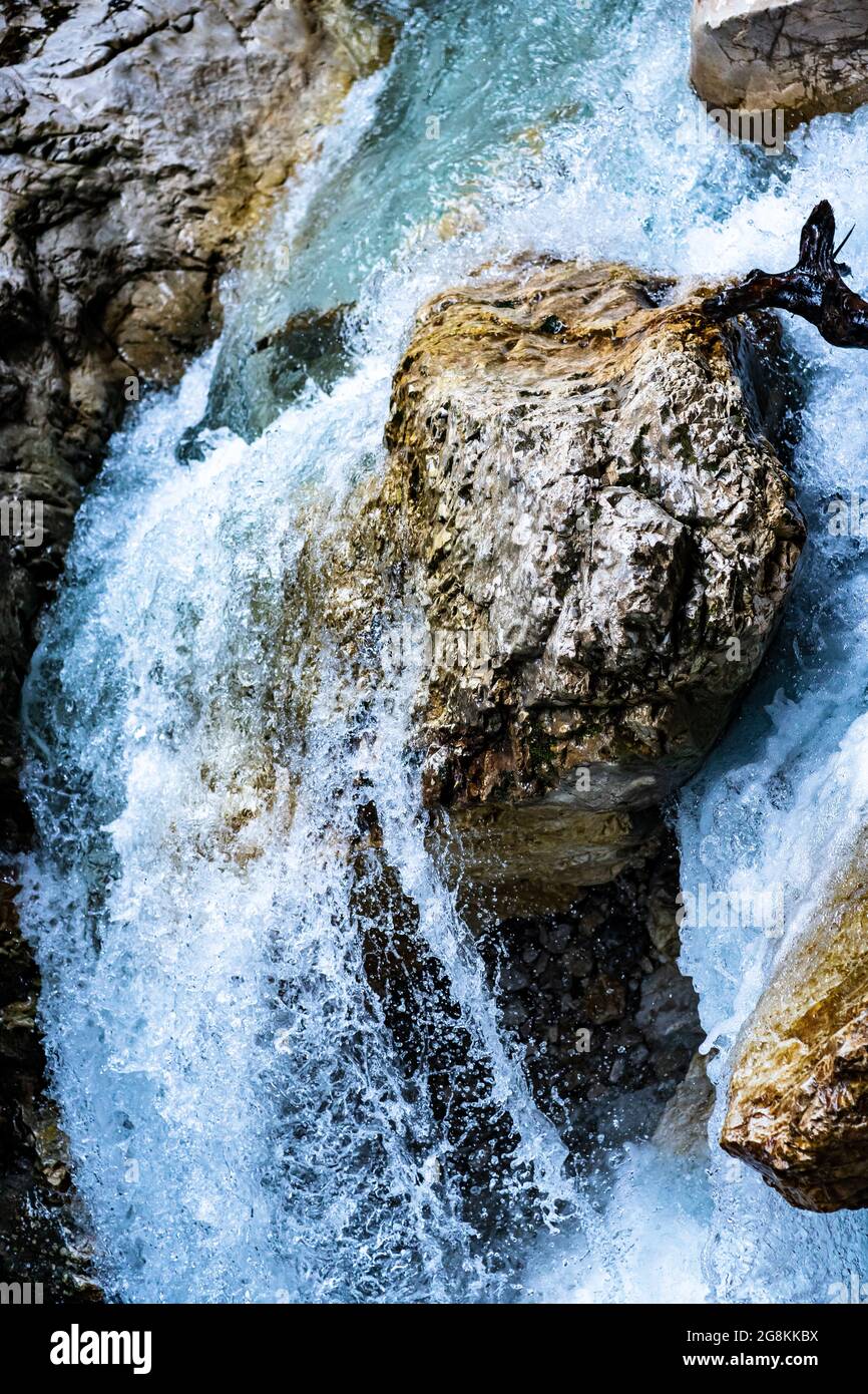 Closeup of a cascade at a river with strong current between rocky ...