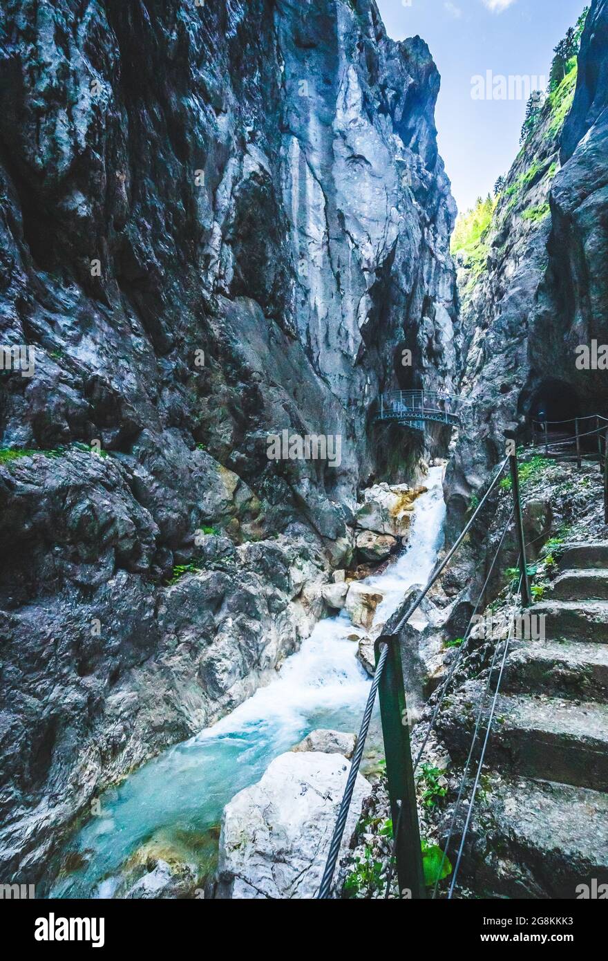 Scenic view of a river flowing among boulders and between rock cliffs ...