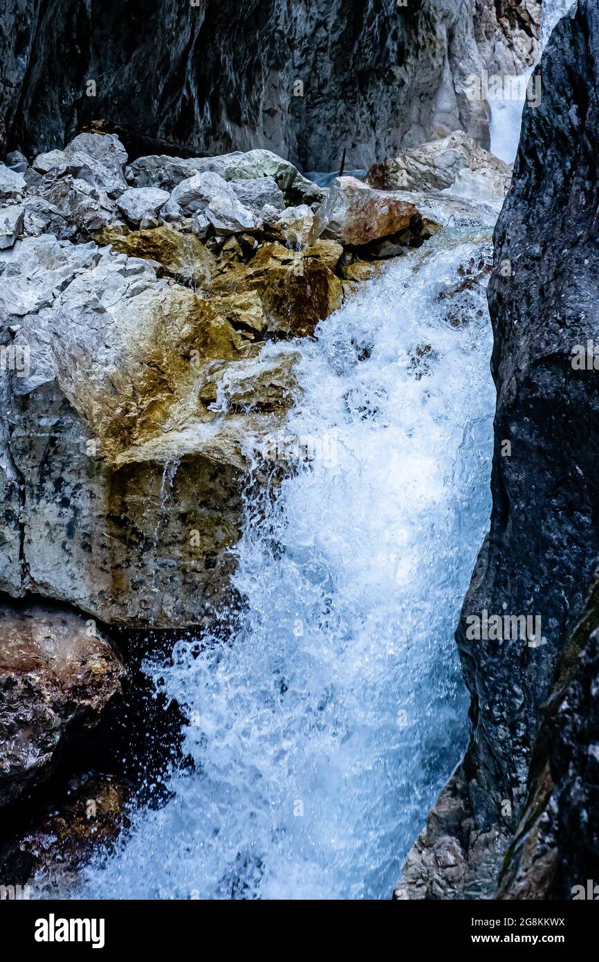 Closeup of a waterfall with strong current between rocky cliffs Stock ...