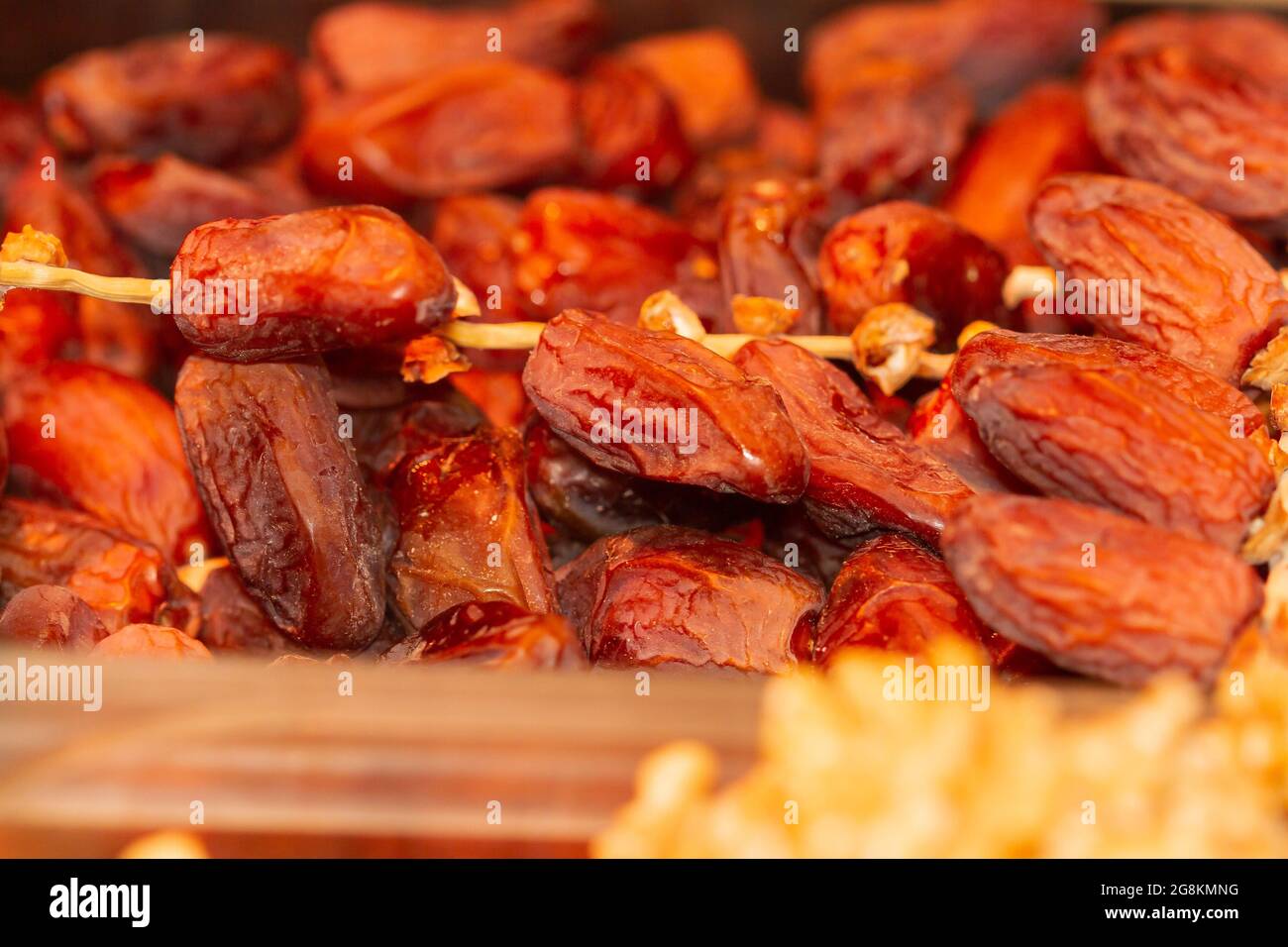 Selective focus of dried dates stacked in glass container ready for ...