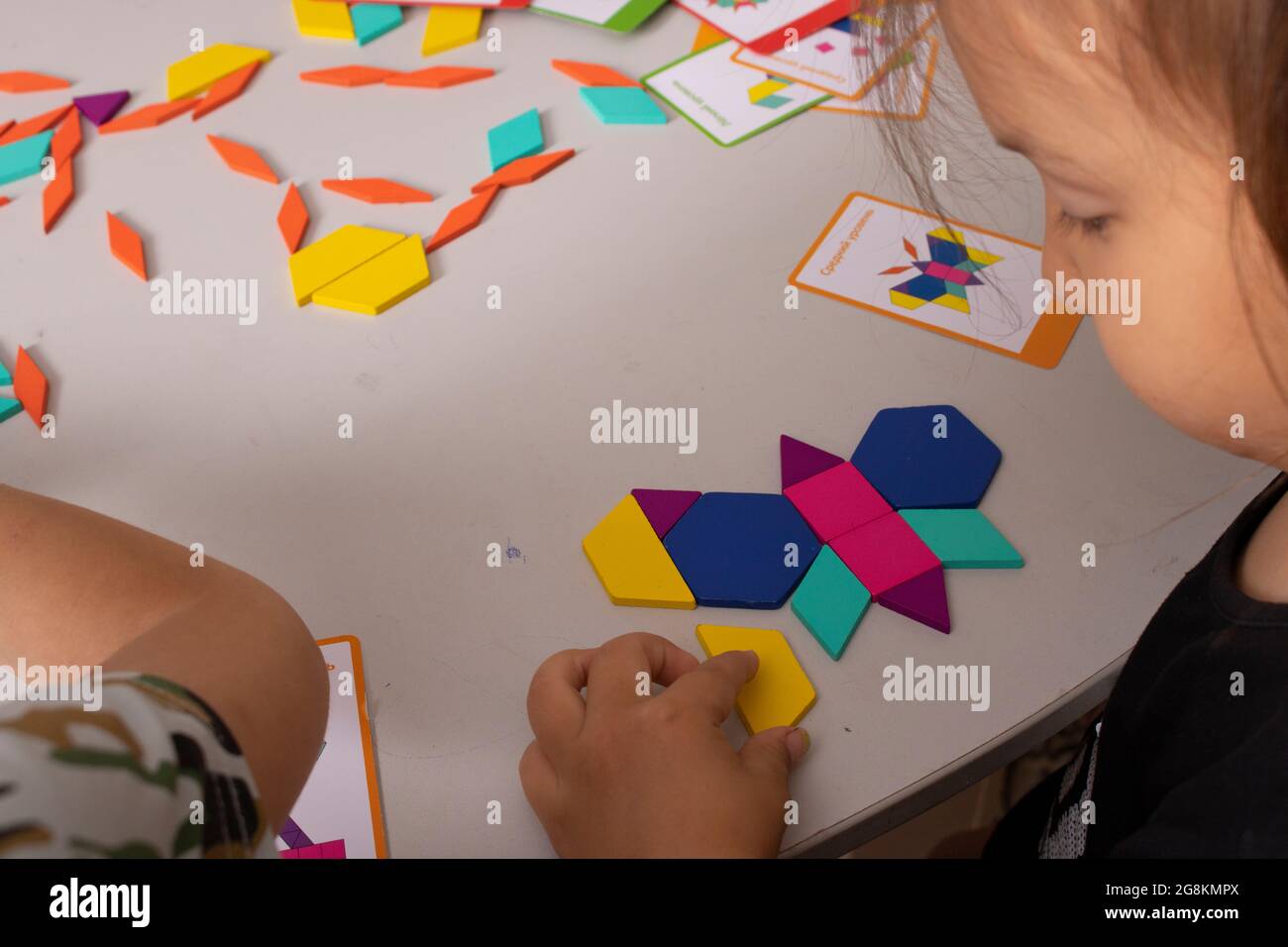 kids modeling with wooden bricksat the table Stock Photo - Alamy