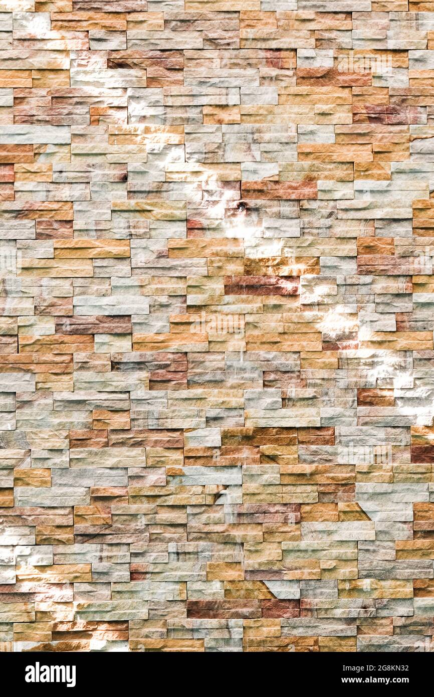 Abstract brown and white rock stone wall texture. Striped shadow and ...