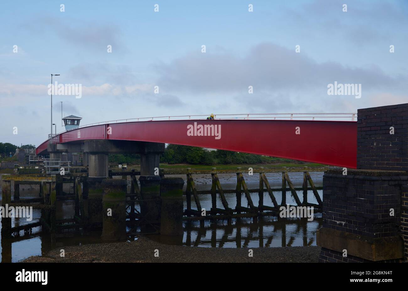 Red foot and bicycle bridge seen in Littlehampton, West Sussex, England ...