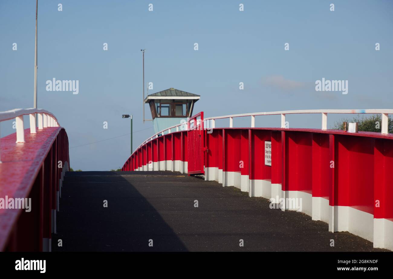 Red foot and bicycle bridge seen in Littlehampton, West Sussex, England ...