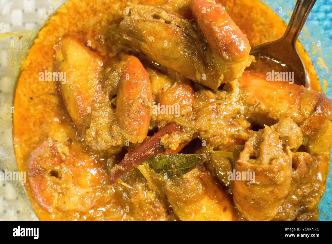 Orange coloured Prawns, cooked and served in a bowl, Indian delicacy ...