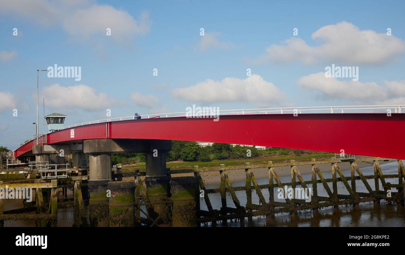 Red foot and bicycle bridge seen in Littlehampton, West Sussex, England ...