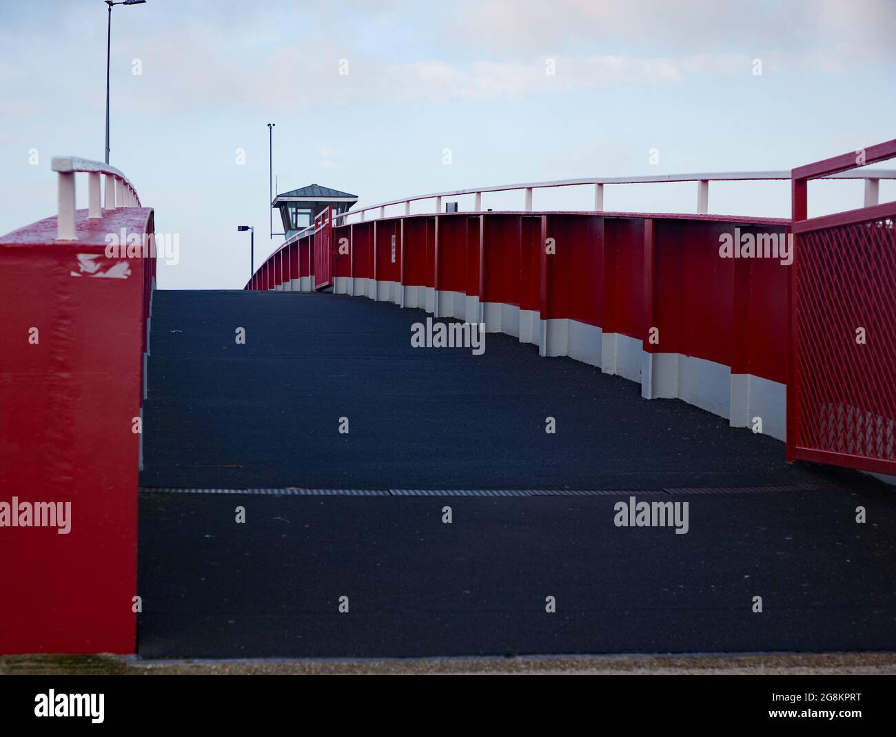 Red foot and bicycle bridge seen in Littlehampton, West Sussex, England ...