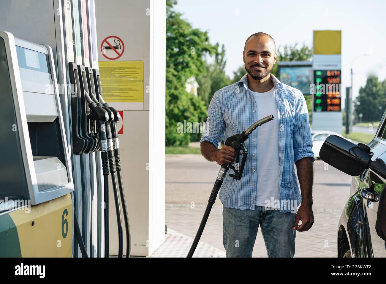 Man filling gasoline fuel in car at gas station Stock Photo - Alamy