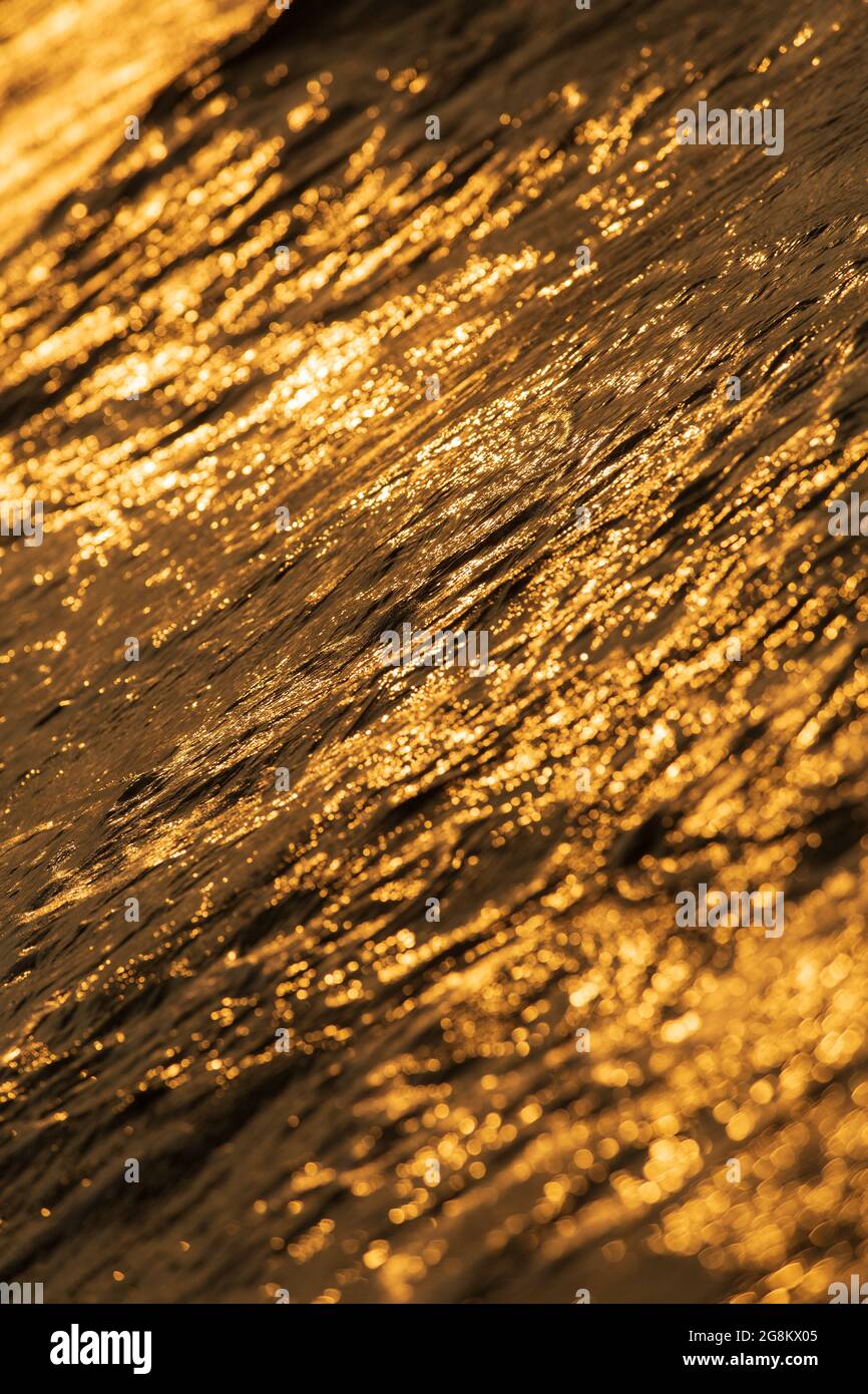 Texture of tropical sea water and wave in golden light of sunset Stock ...