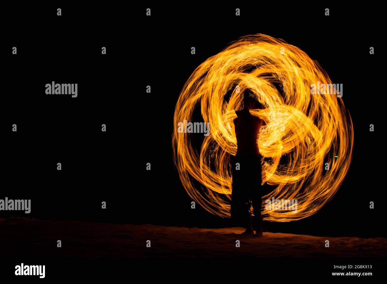 Fire playing show on beach of island in Thailand Stock Photo - Alamy