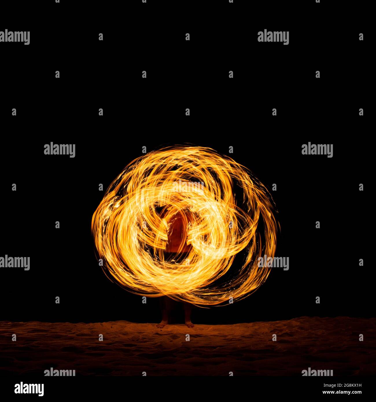 Fire playing show on beach of island in Thailand Stock Photo - Alamy