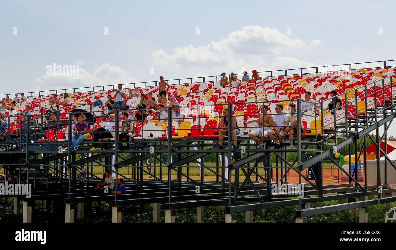 Spectators tribune in the heat during the "Moscow Mile" supercars race ...