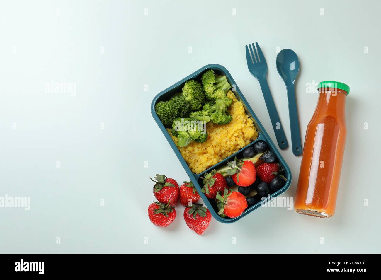 Lunch box with tasty food on white background Stock Photo - Alamy