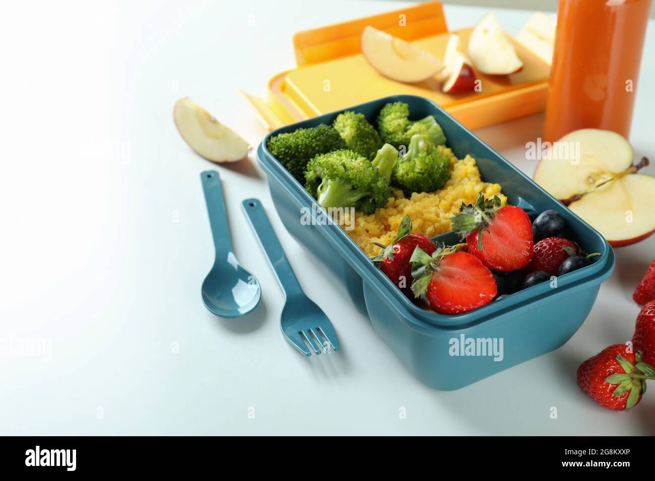 Lunch box with tasty food on white background Stock Photo - Alamy