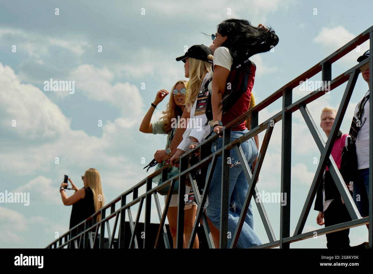 Spectators view the "Moscow Mile" supercars race from the podium. The ...
