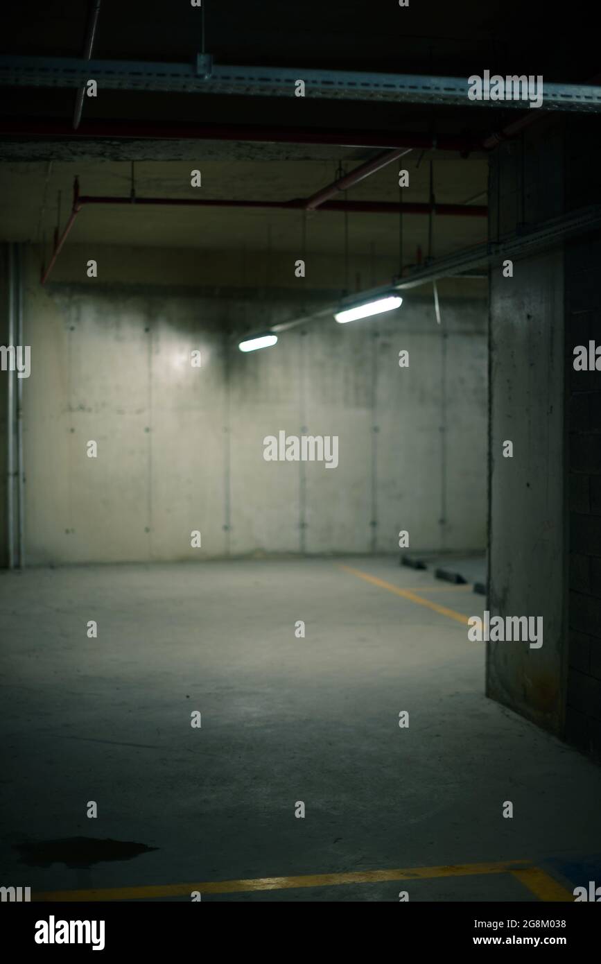 Two fluorescent lights concrete walls and floor like scary movie ...