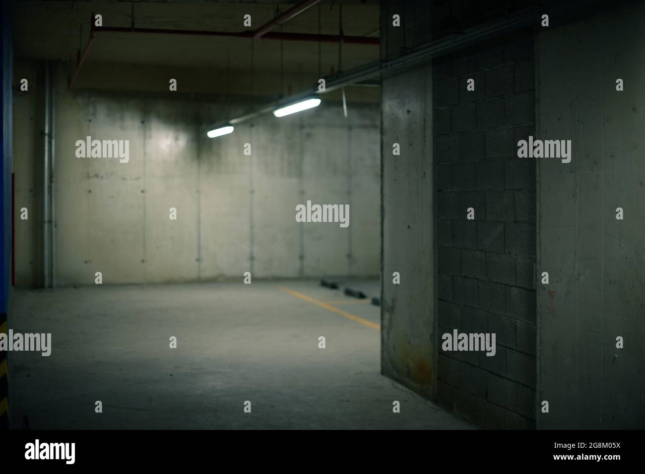 Two fluorescent lights concrete walls and floor like scary movie ...